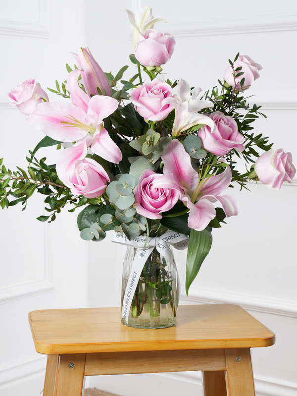 Pink Roses and Pink Lily in a vase | Sympathy Flowers - FlowersDirect.ie
